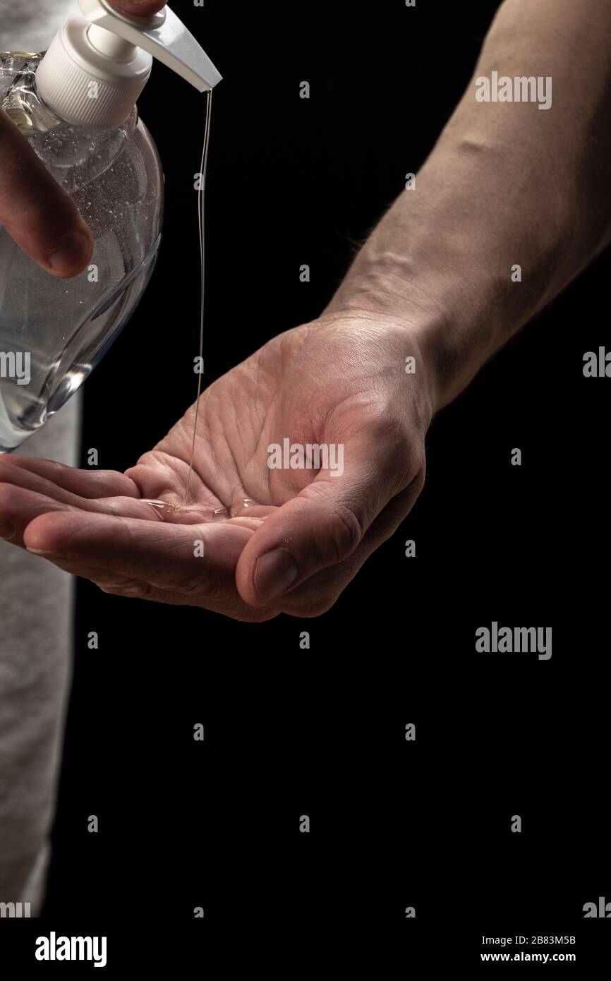 Young man is holding taking giving throwing a soap bottle for washing ...