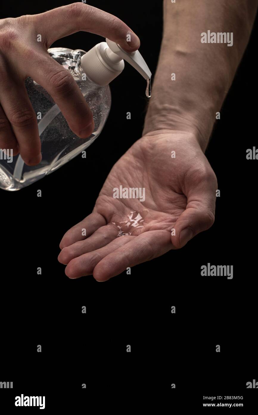 Young man is holding taking giving throwing a soap bottle for washing ...