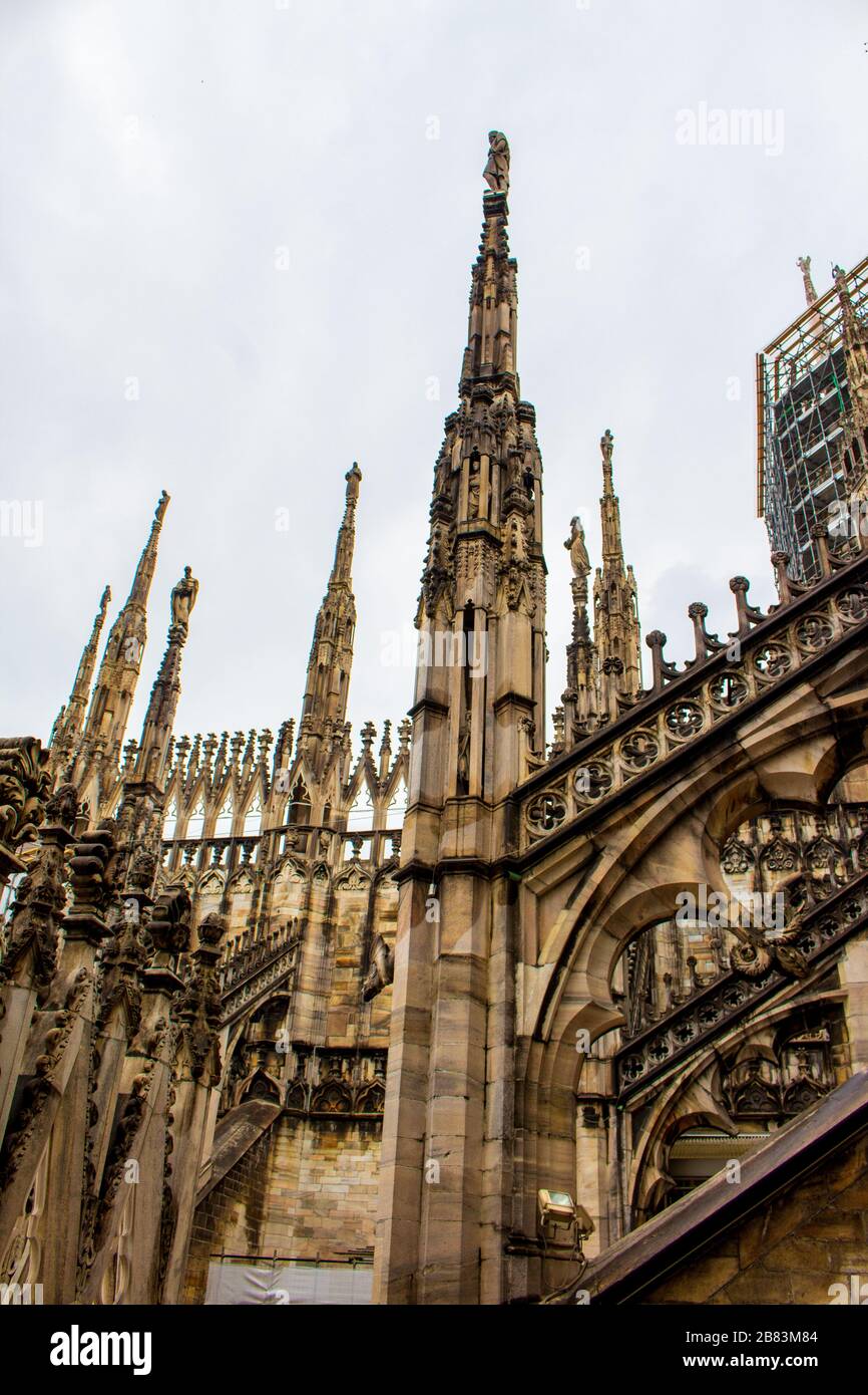 Richly decorated with spires and statues magnificent rooftop of Milan ...