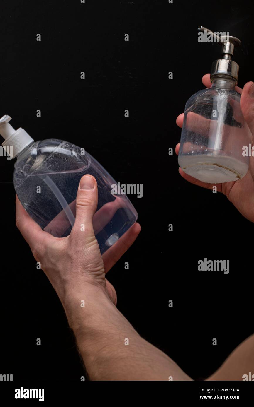 Young man is holding taking giving throwing a soap bottle for washing ...