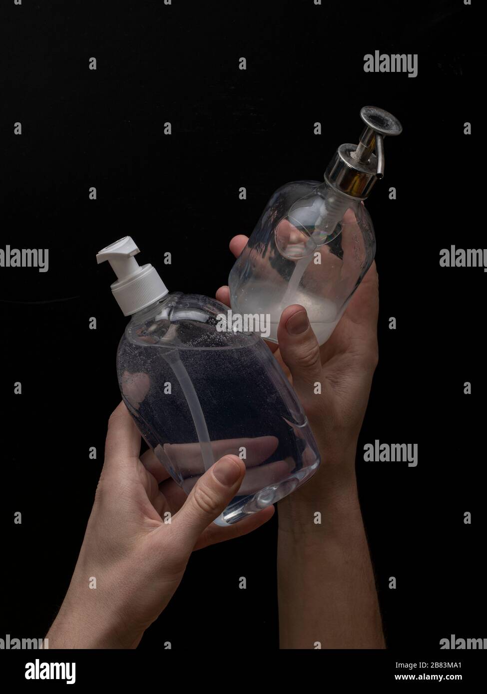 Young man is holding taking giving throwing a soap bottle for washing ...