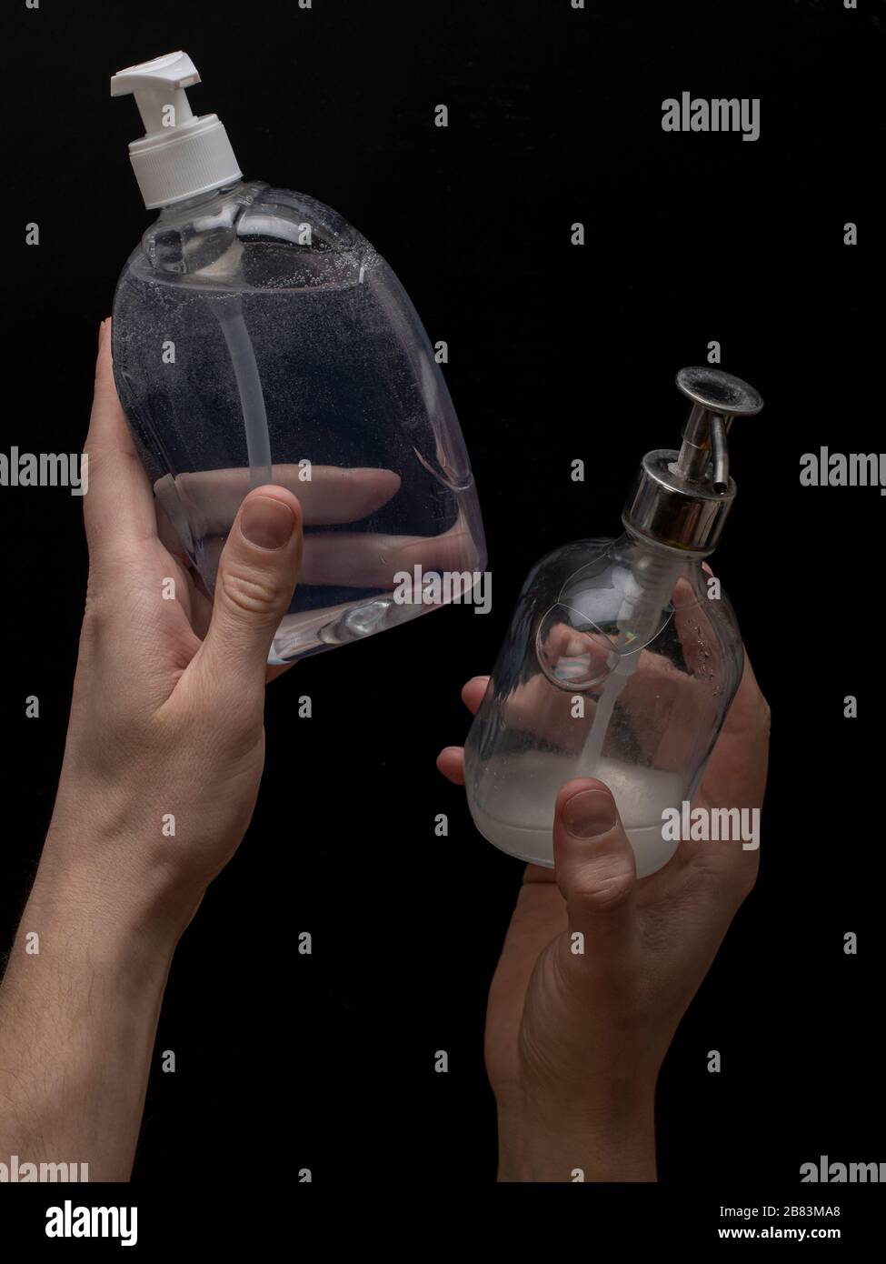 Young man is holding taking giving throwing a soap bottle for washing ...