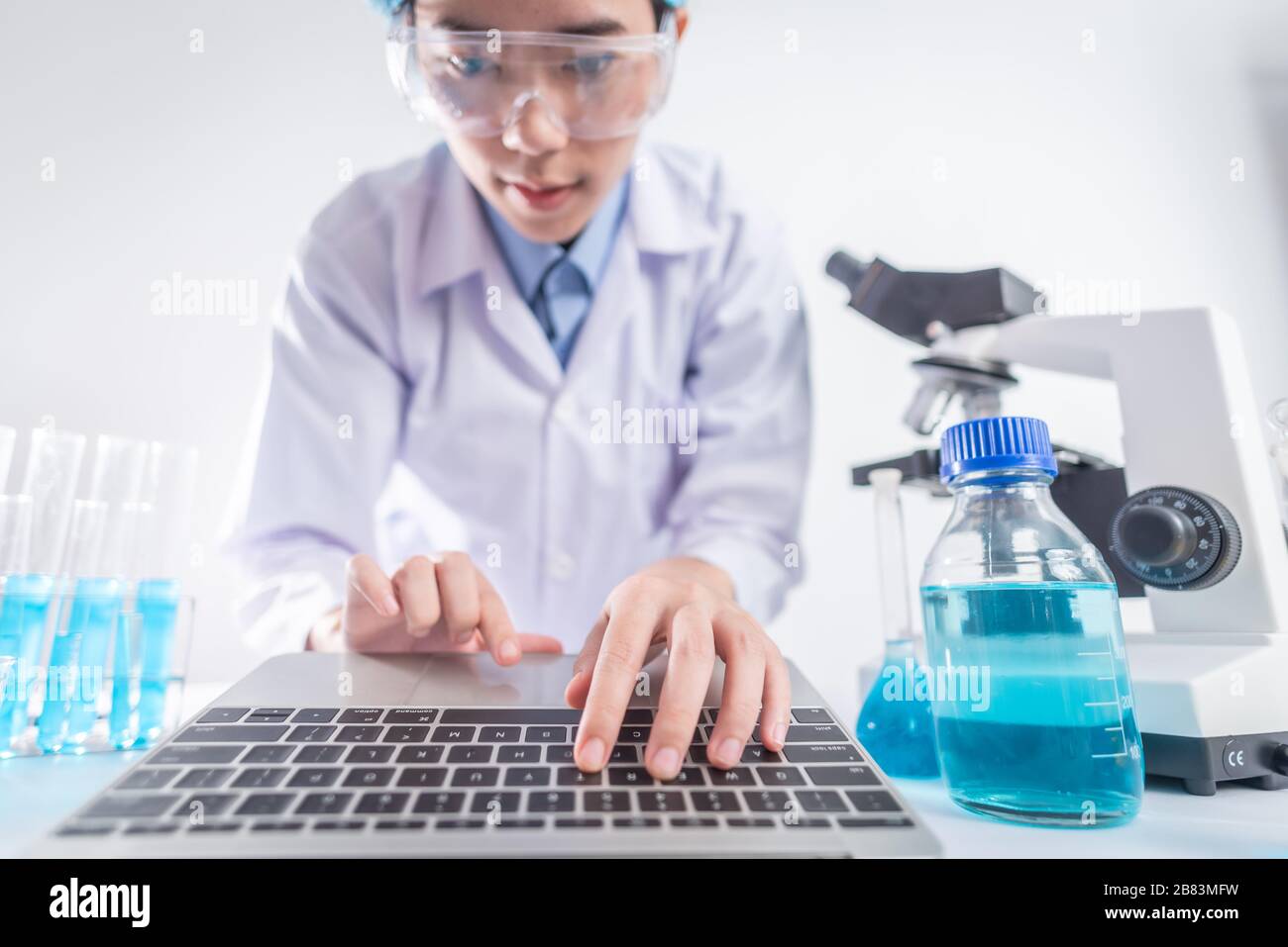 Researchers are analyzing data using a laptop. In the laboratory Stock ...