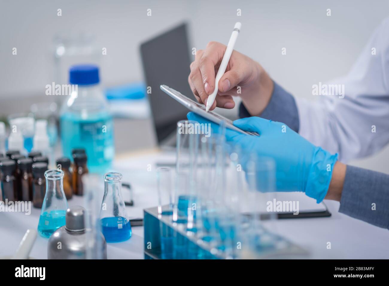 Doctors use tablets to analyze treatment outcomes and study medical ...