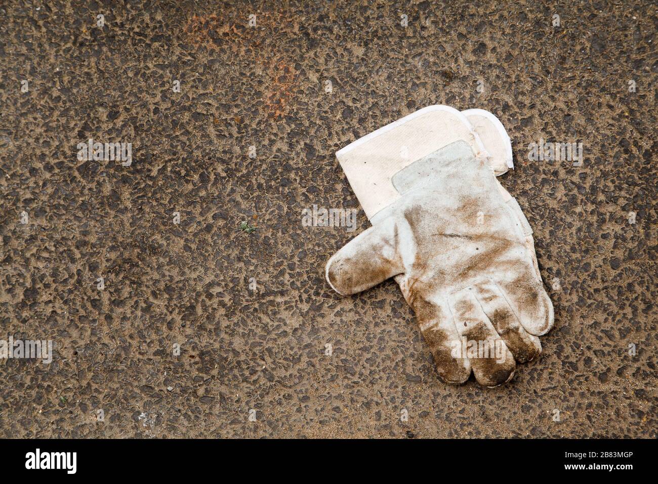 Dirty hand gloves hi-res stock photography and images - Alamy