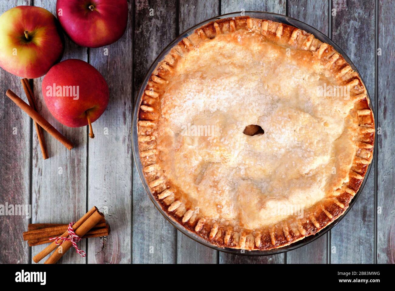 Delicious autumn apple pie, overhead table scene on a rustic wood ...
