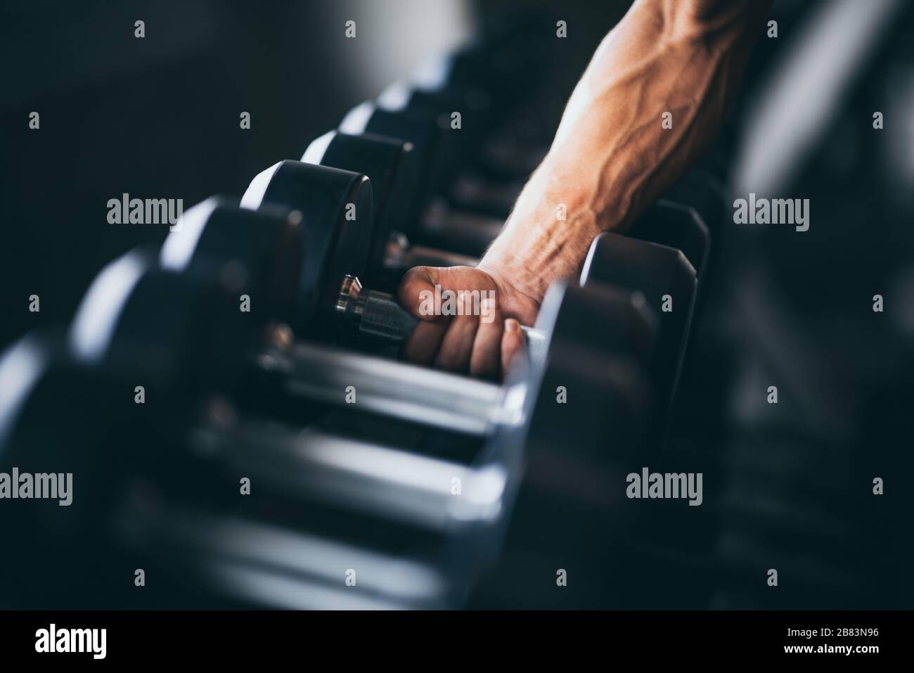 Man rows dumbbells hi-res stock photography and images - Alamy