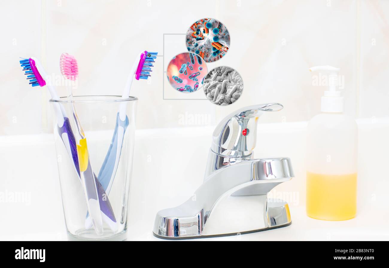 Dental hygiene. Tooth brushes with bacteria in glass in the bathroom ...