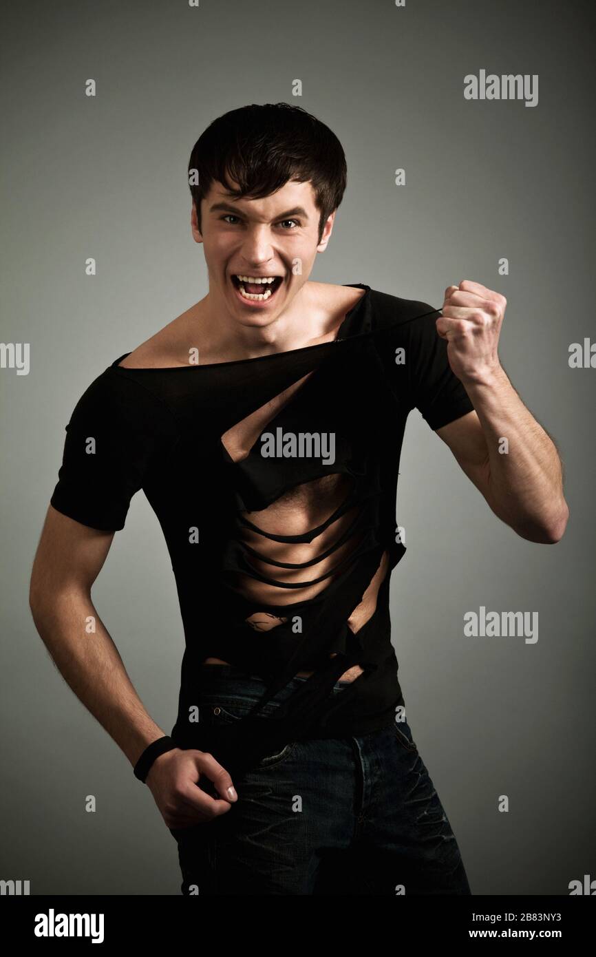 Anger man in black damaged clothing standing shouting and looking at ...
