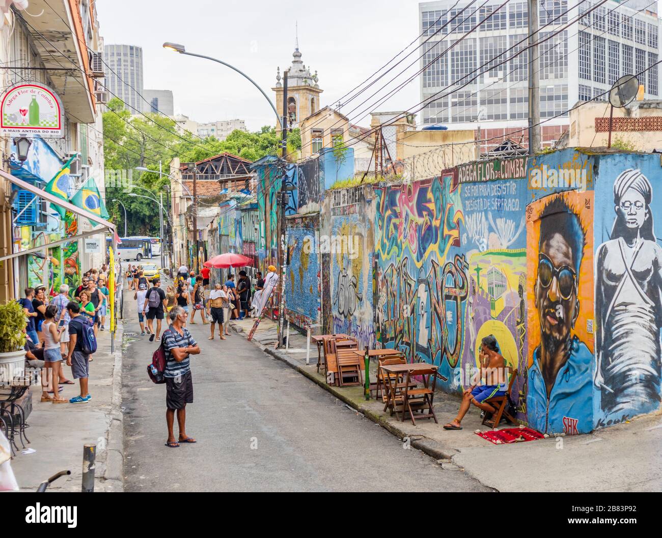 Busy street scene with colourful murals by the Escadaria Selaron ...