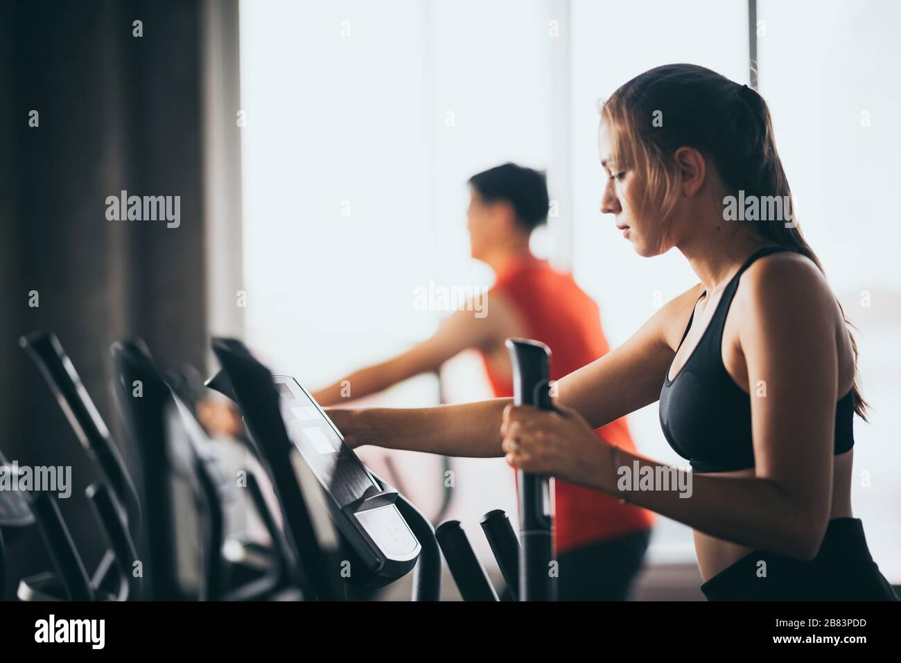 People running in machine treadmill at fitness gym club Stock Photo - Alamy