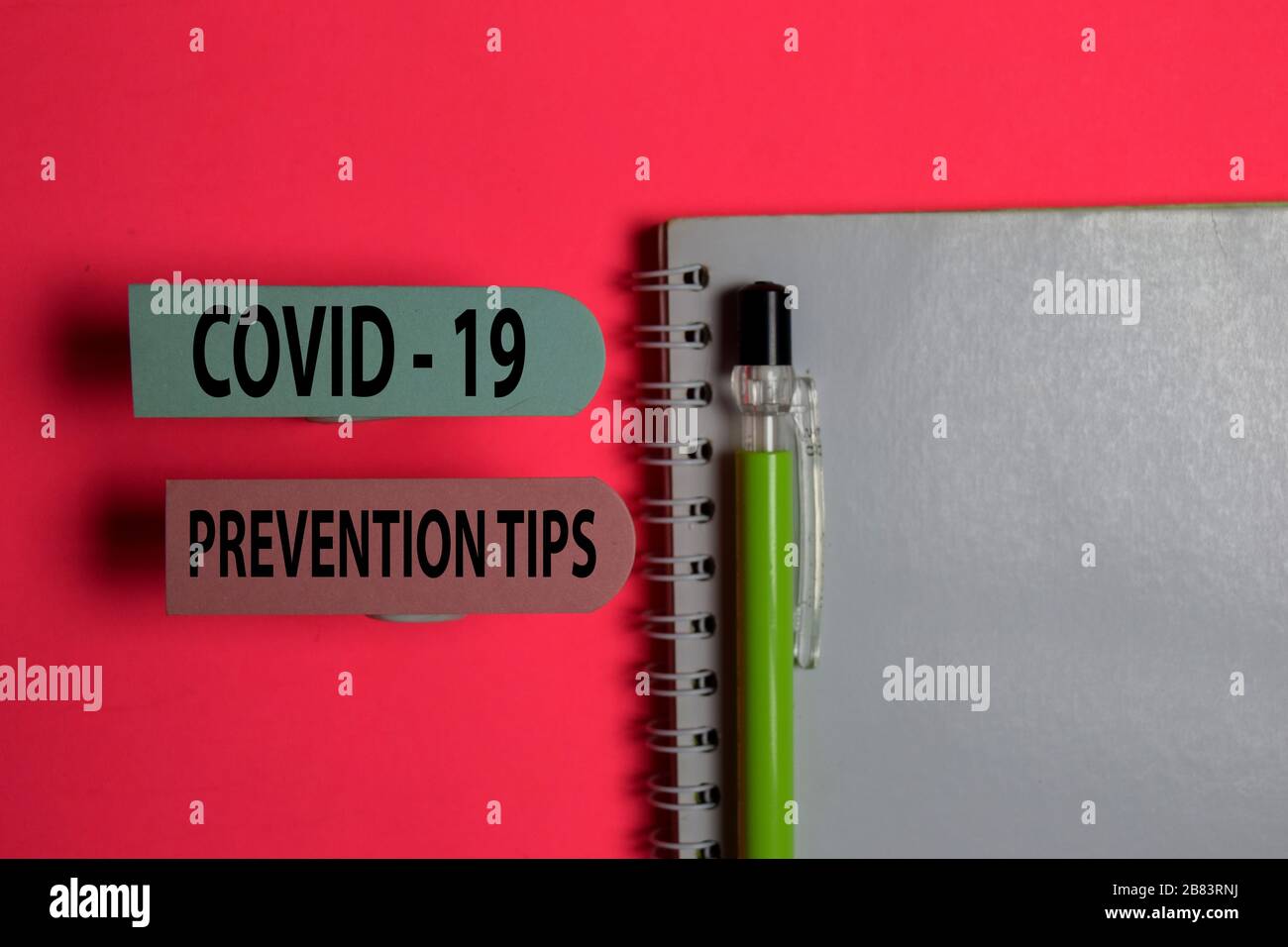 Covid - 19 Prevention Tips write on a sticky note isolated on Office ...