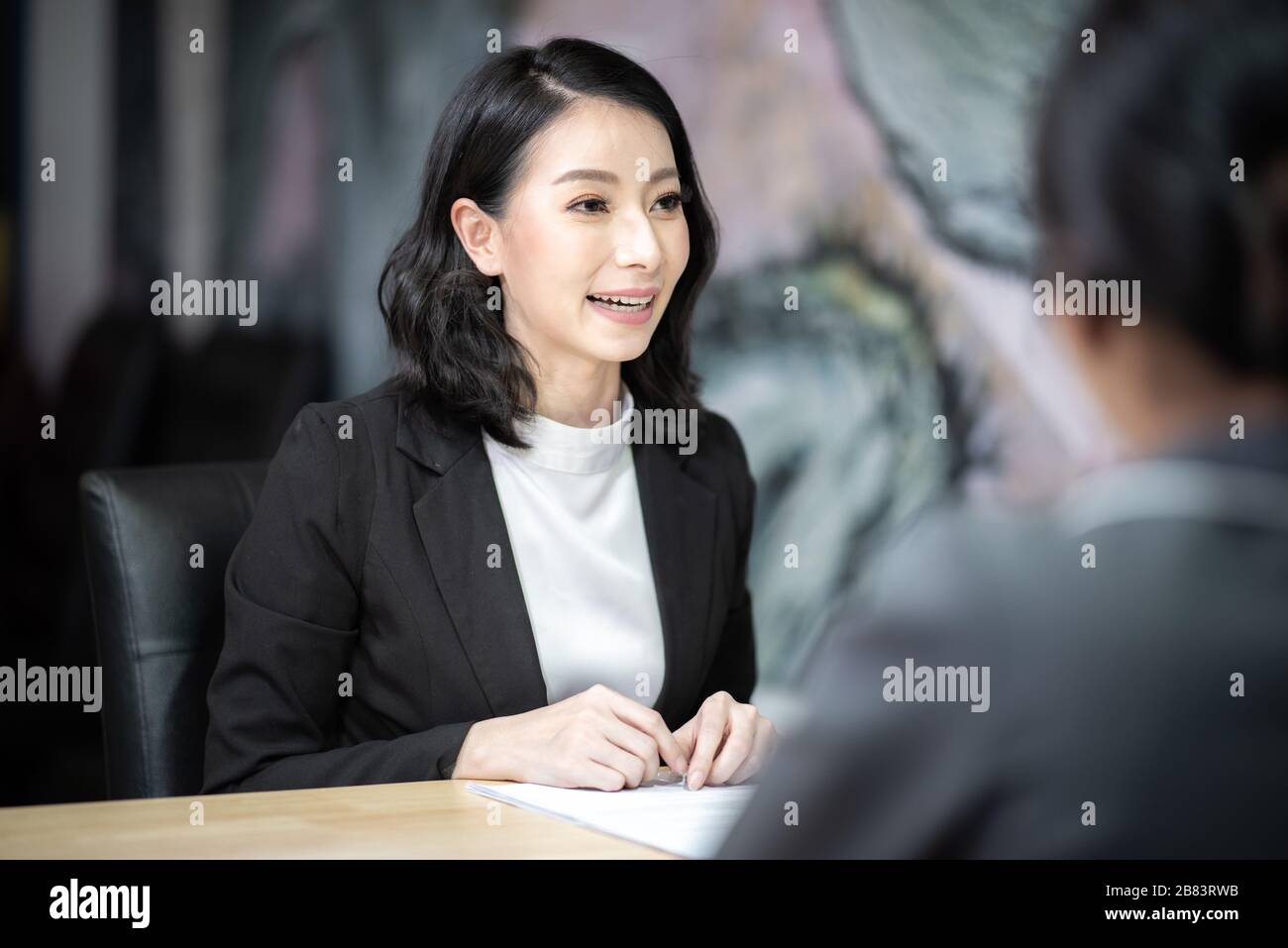 Successful job interview with boss and employee Stock Photo - Alamy