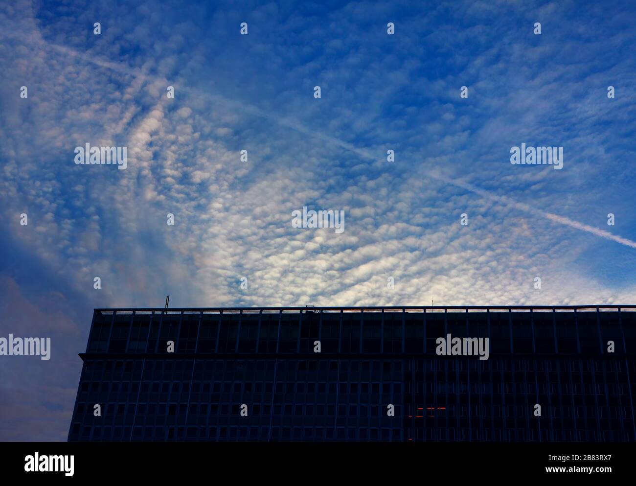 black modern building and blue sky with clouds Stock Photo - Alamy