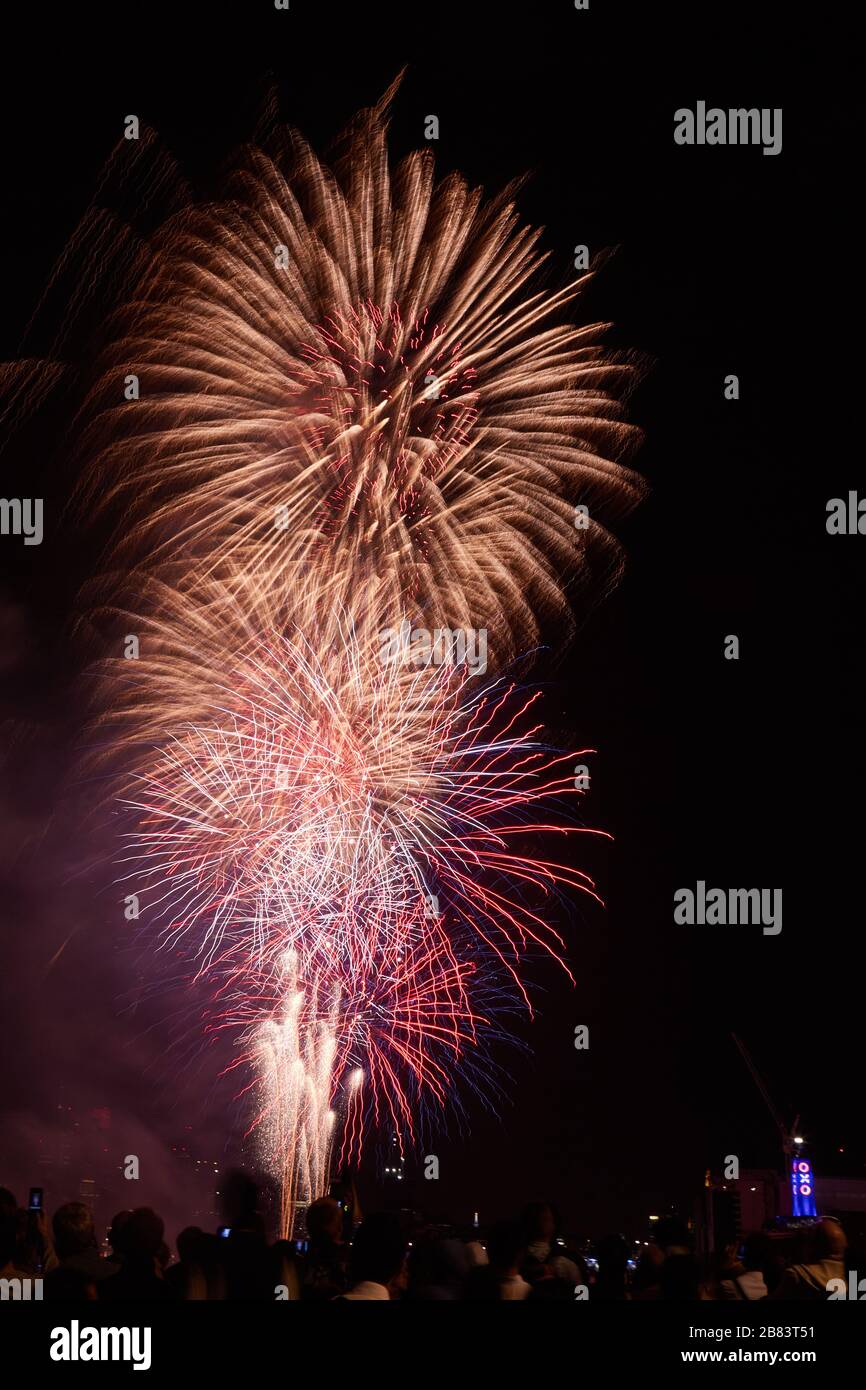 Multi-colored fireworks display in portrait image mode during Thames ...