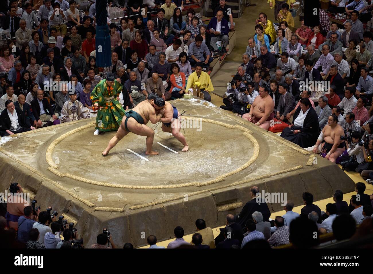 Sumo wrestlers fighting in the wrestling ring at 2013 September Grand ...