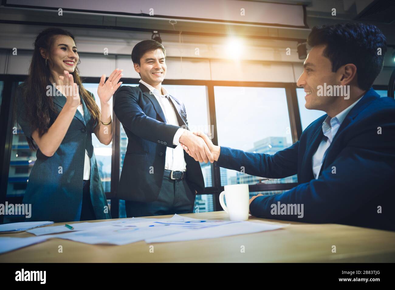 Business cooperation A group of business people showing cooperative ...