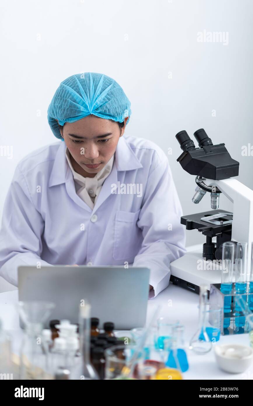 using laptop for working in laboratory Stock Photo - Alamy
