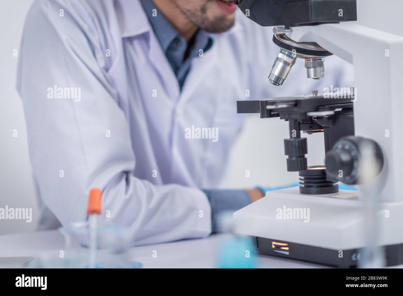 Using a microscope for research in the laboratory, Modern technology ...