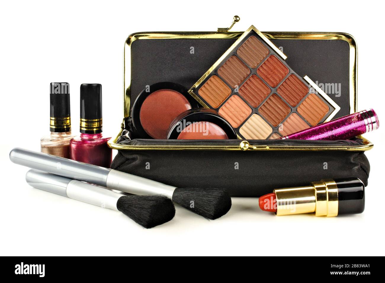 Makeup bag with assorted beige hue cosmetics isolated on white Stock ...