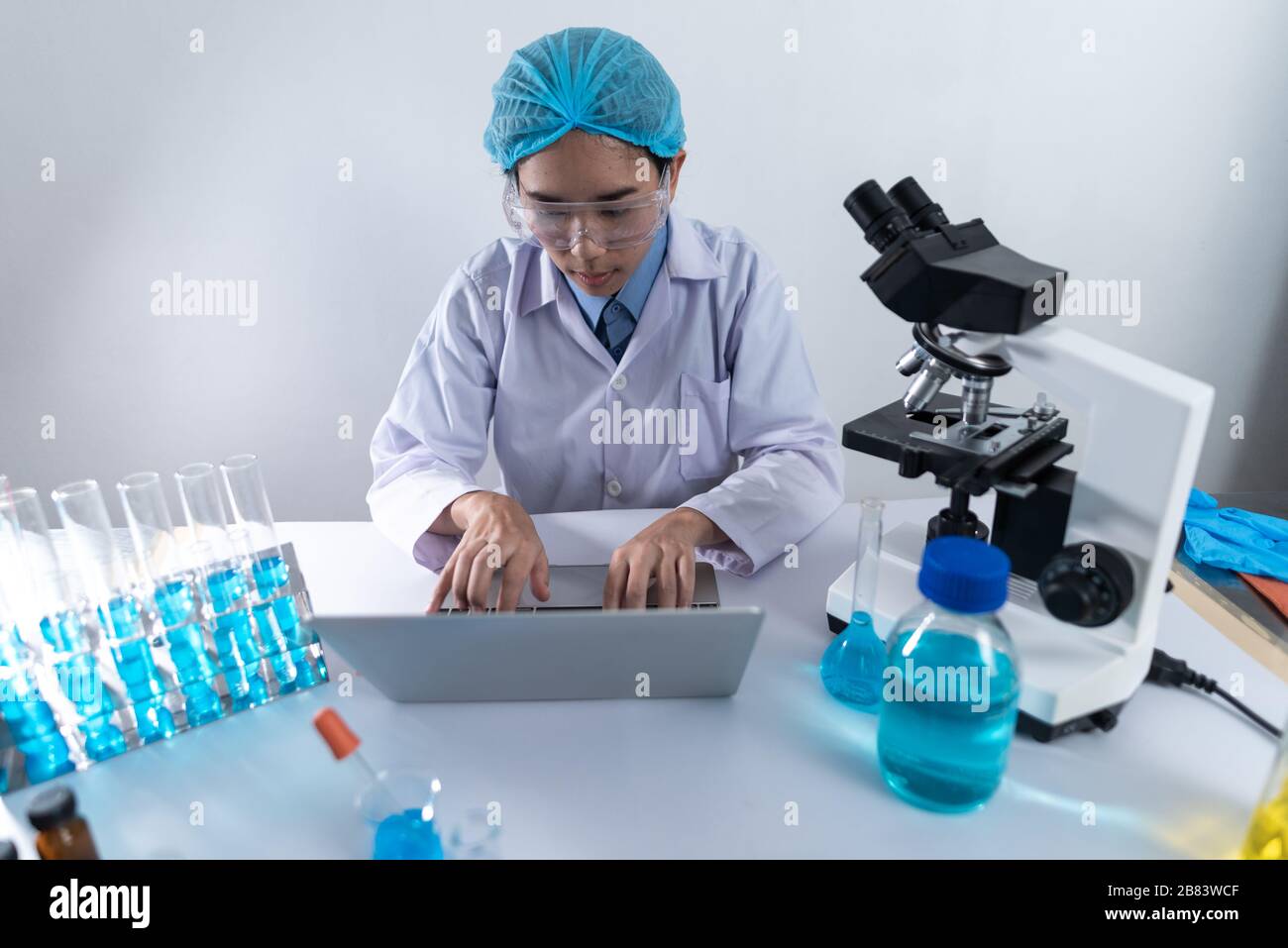 using laptop for working in laboratory Stock Photo - Alamy