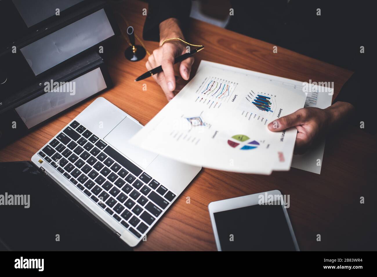 The business man working with high technology for benefit graph ...