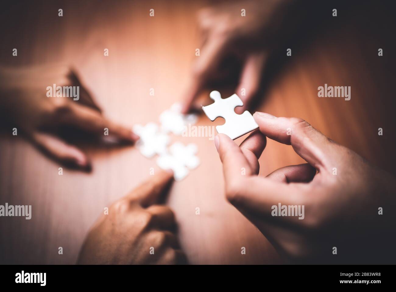 Hand holding jigsaw puzzles, Business partnership concept Stock Photo ...