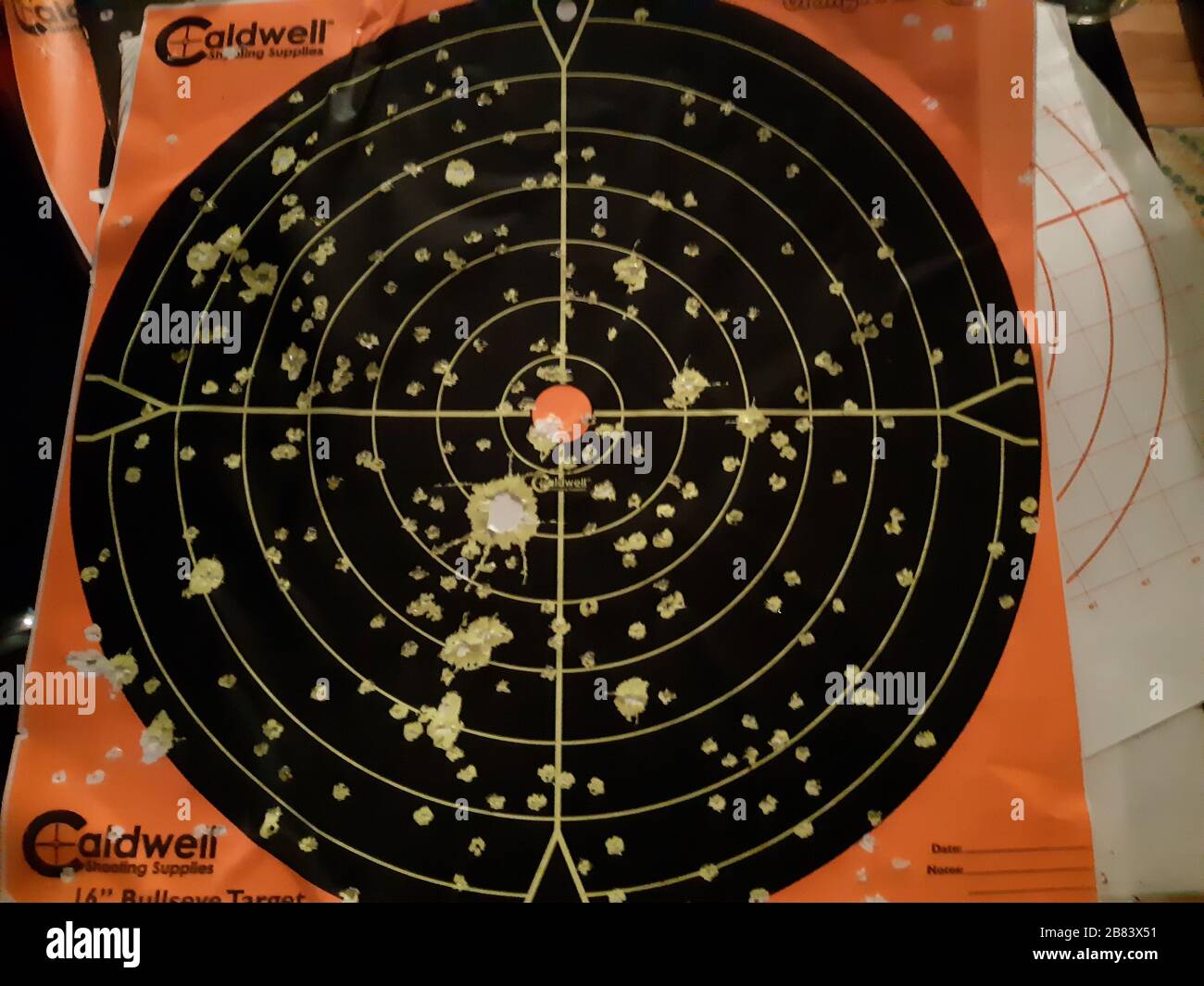 Target with holes from bullet, buckshot, slugs, shooting range Stock ...