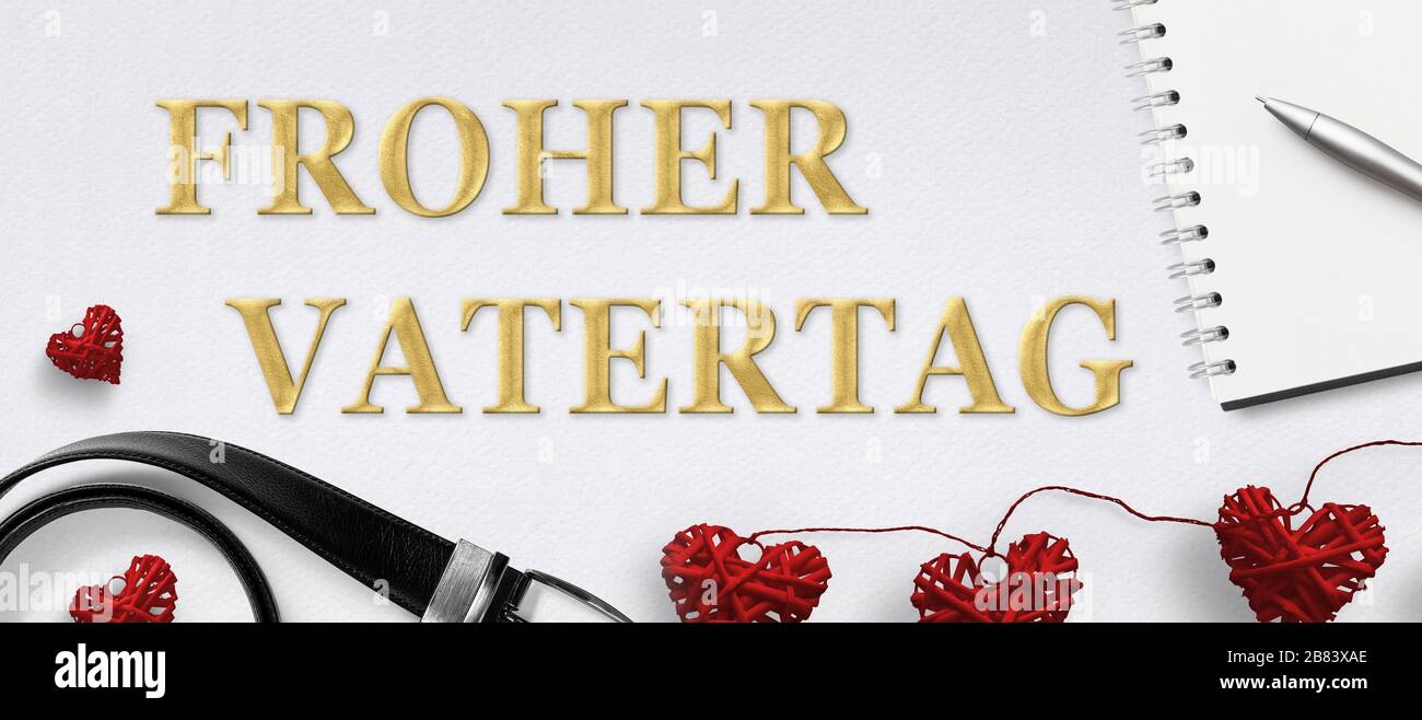 German message HAPPY FATHER'S DAY in golden letters on paper background ...