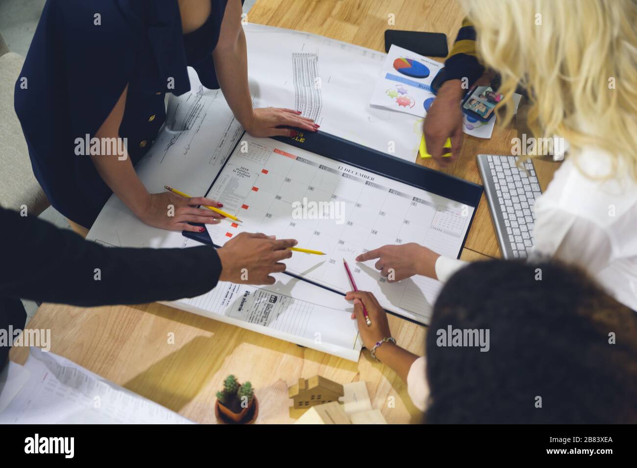 Schedule the job planning on the calendar for success teamwork Stock ...