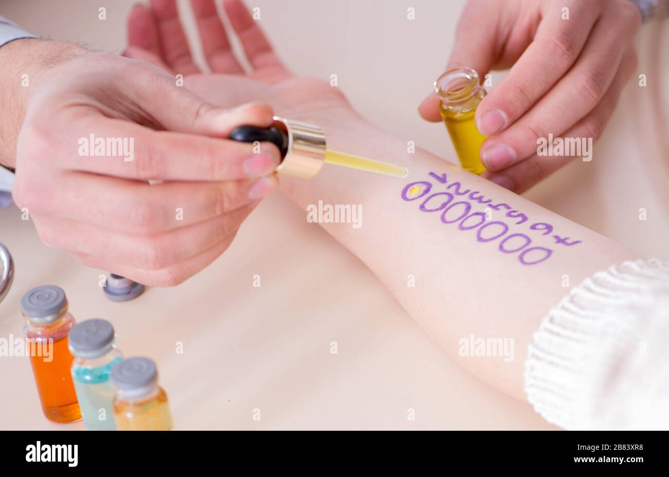 The doctor testing allergy reaction of patient in hospital Stock Photo ...