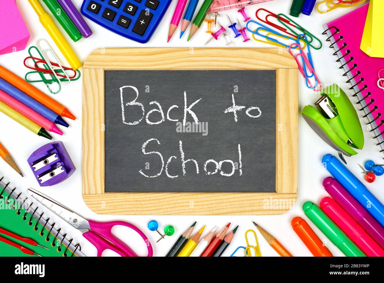 Back to School chalkboard on a white background with school supplies ...