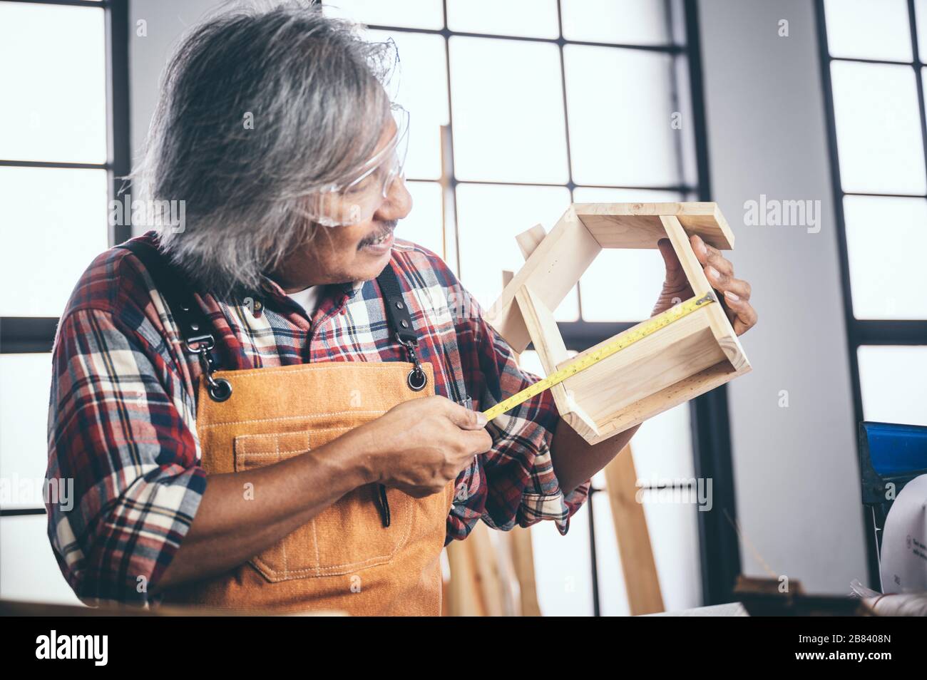 Background image of woodworking workshop: carpenters work table with ...