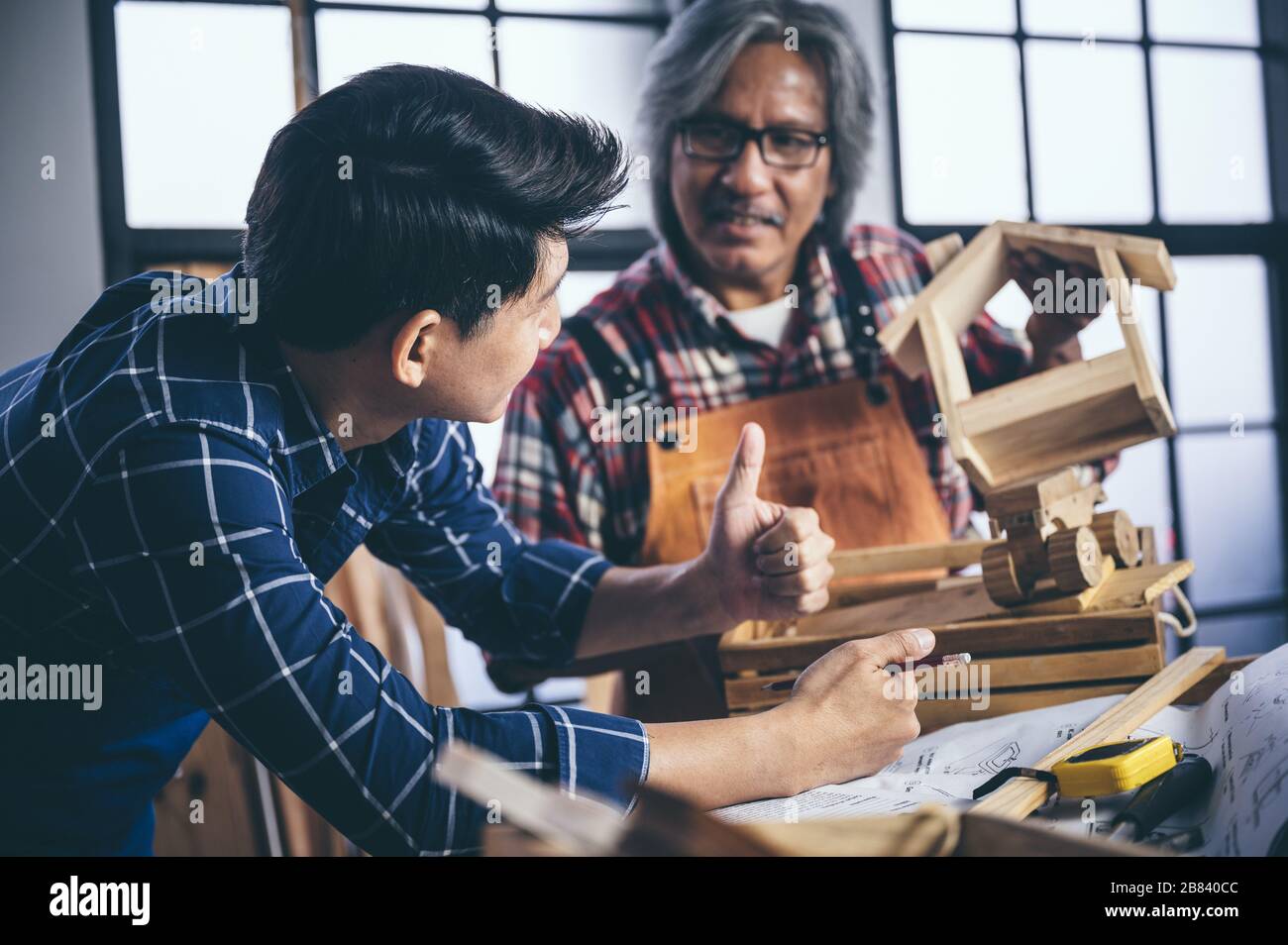 carpenters team work together creatively, creative carpenter Stock ...