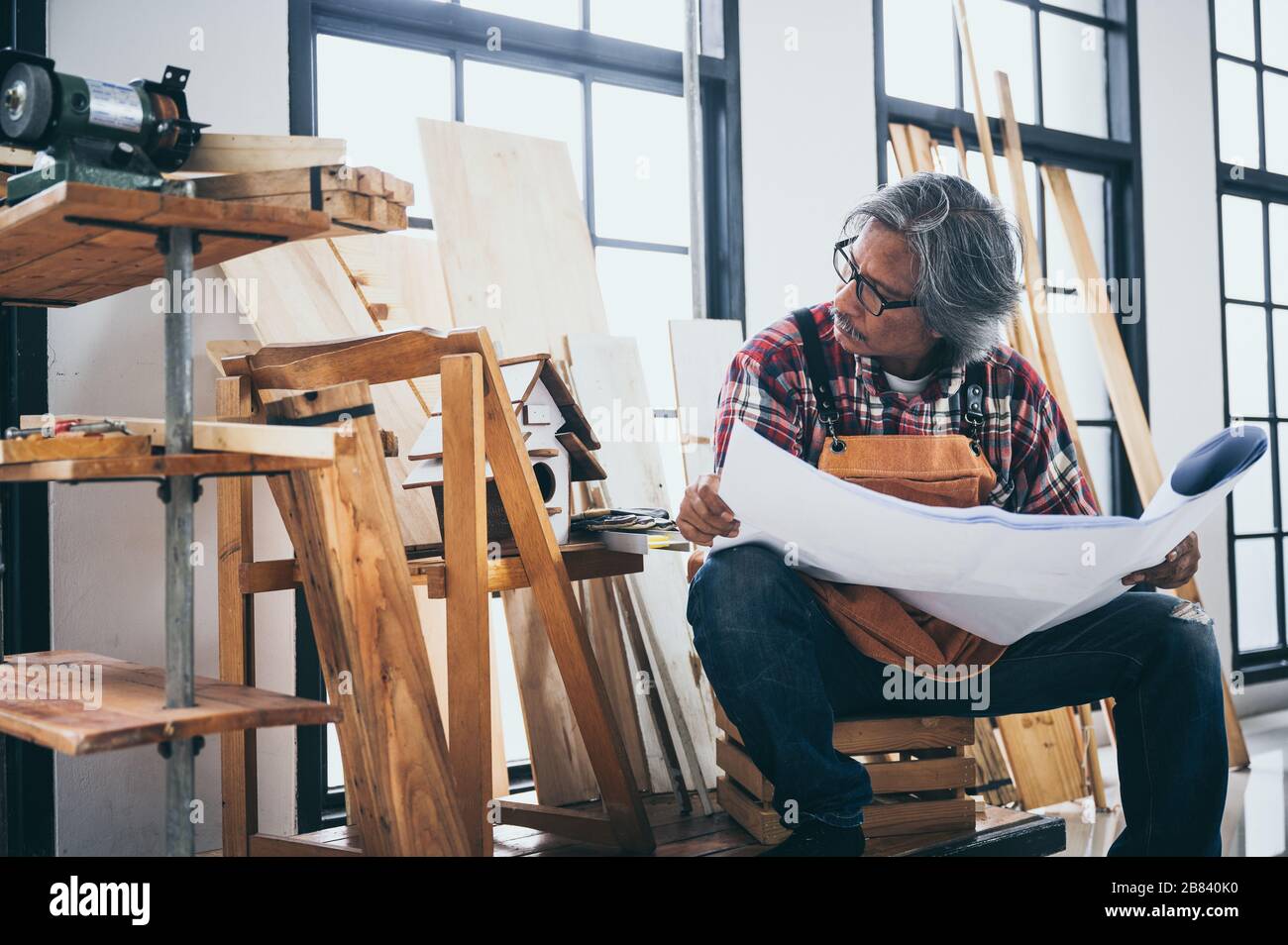 Background image of woodworking workshop: carpenters work table with ...