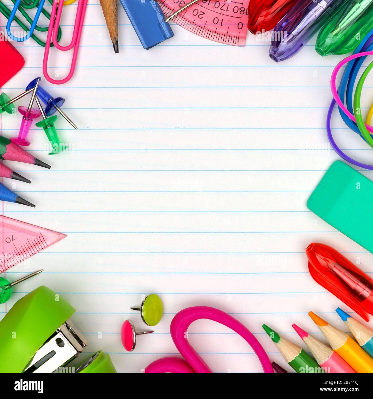 Colorful school supplies square frame over a lined paper background ...