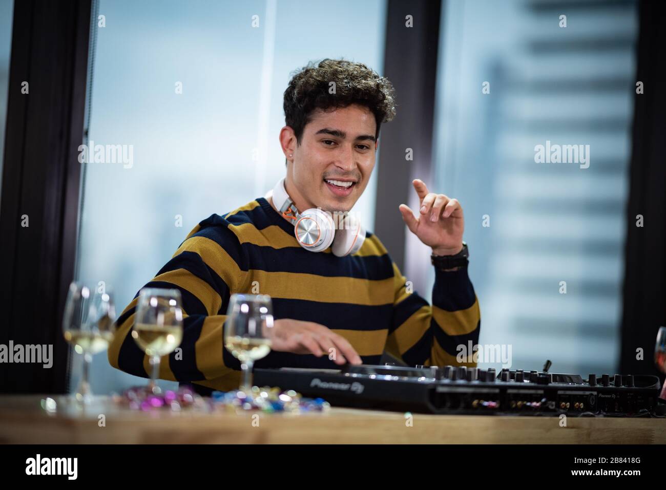 Male DJ playing music in party Stock Photo - Alamy