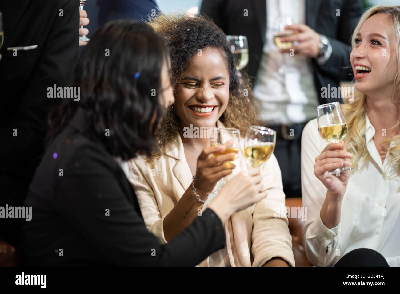 Toast to success. Group of business people toasting with champagne and ...