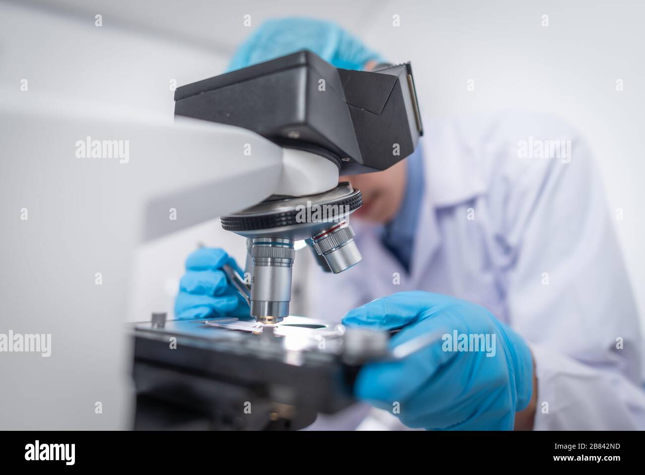 Using a microscope for research in the laboratory, Modern technology ...
