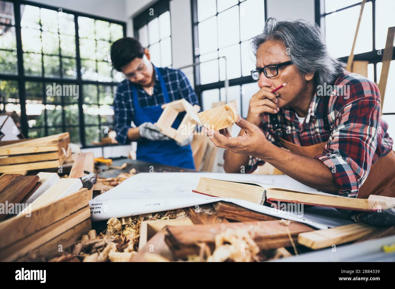 carpenters team work together creatively, creative carpenter Stock ...