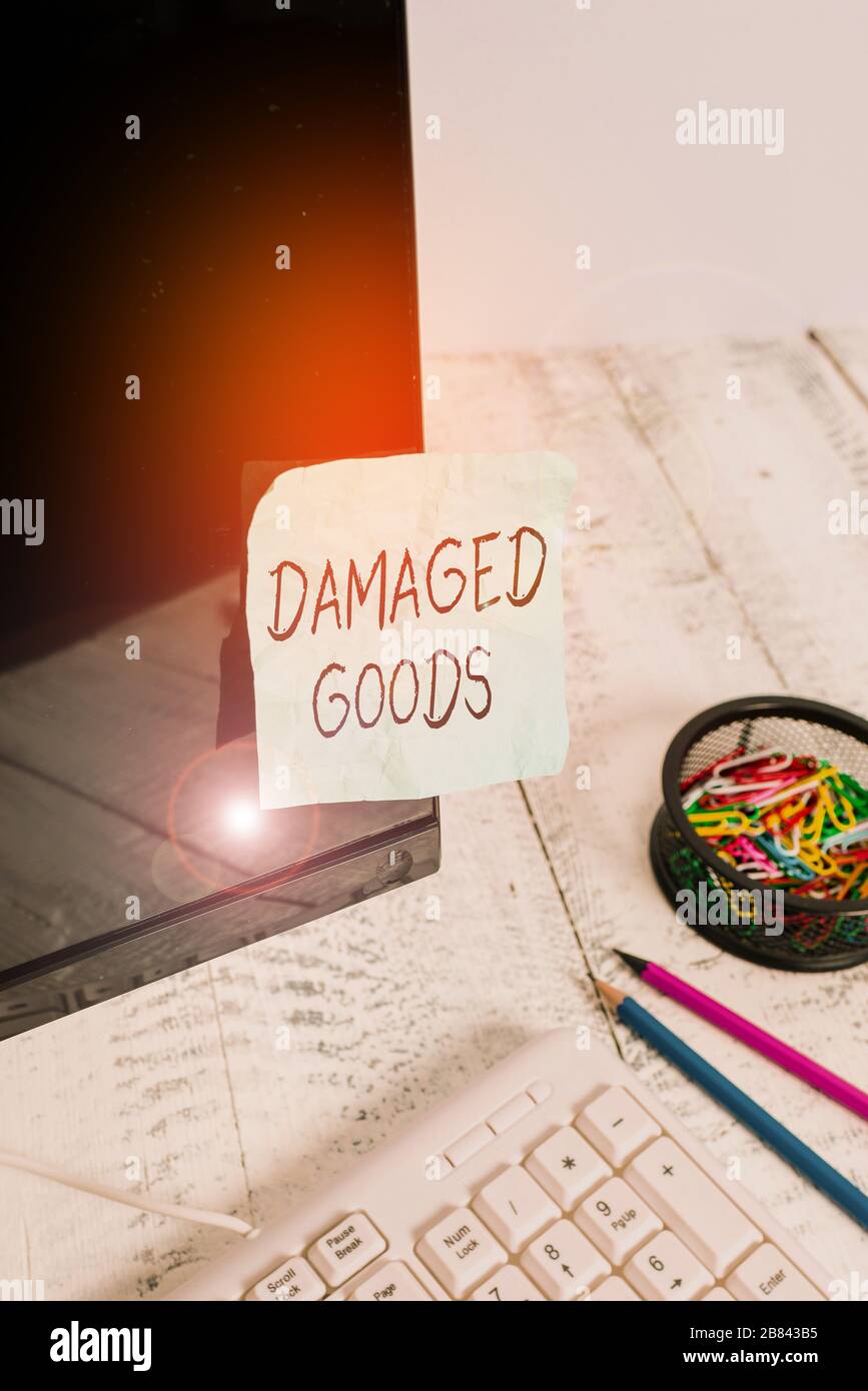 Writing note showing Damaged Goods. Business concept for Products or ...