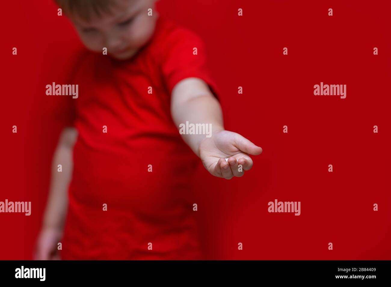 Kid Reach Out Hand High Resolution Stock Photography and Images - Alamy