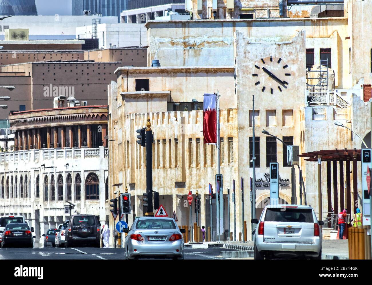 View of traffic on a road near to Souq Waqif Clock Tower - Doha, Qatar ...