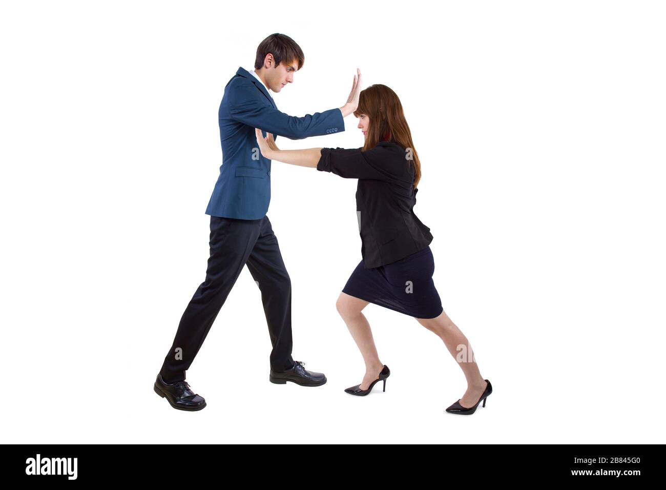 Businessman and Businesswoman pushing each other away. Depicts social ...