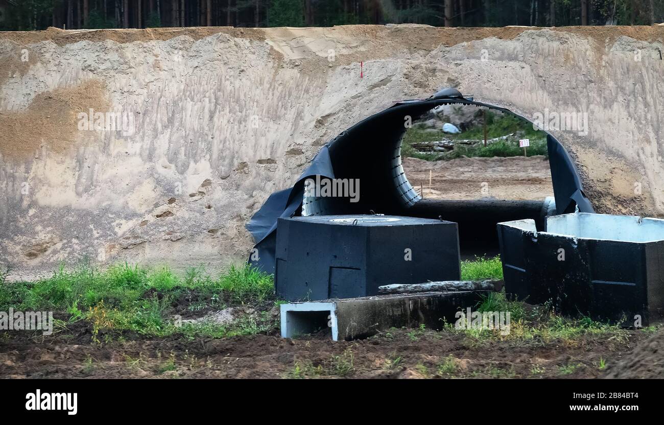 Construction of the highway. Laying culvert in sand bed Stock Photo - Alamy
