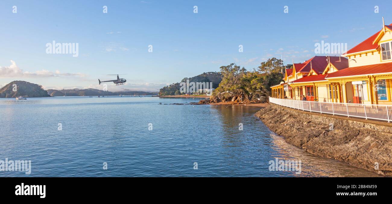 A helicopter coming in to land at Paihia, the main tourist town in the ...