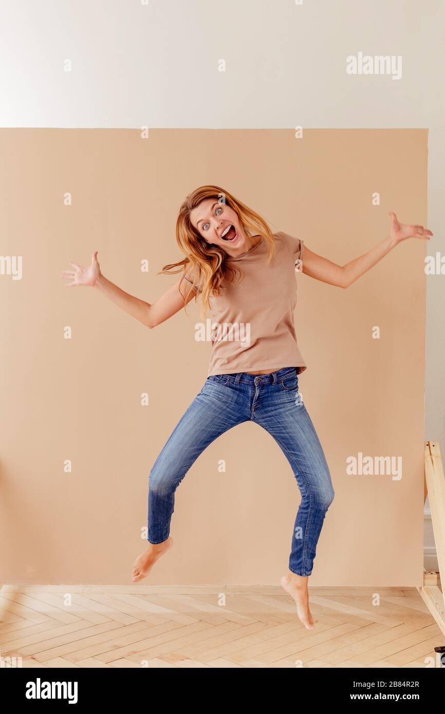 Happy jump young woman hi-res stock photography and images - Alamy