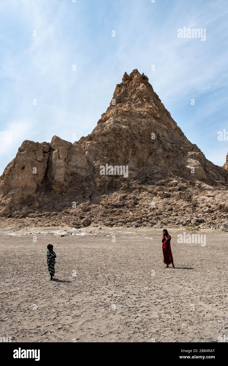 Africa, Djibouti, Lake Abbe. Landscape view of lake Abbe Two children ...