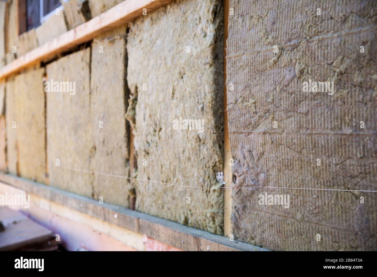 warming the walls of a stone house with a stone wool heater. Ecological ...