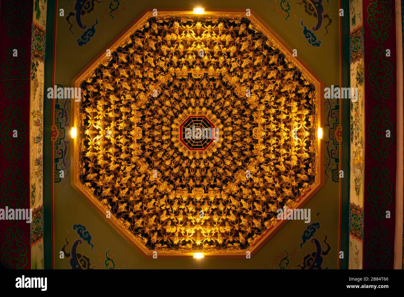 The patterns of wood carved as beautiful deities on the ceiling of the ...